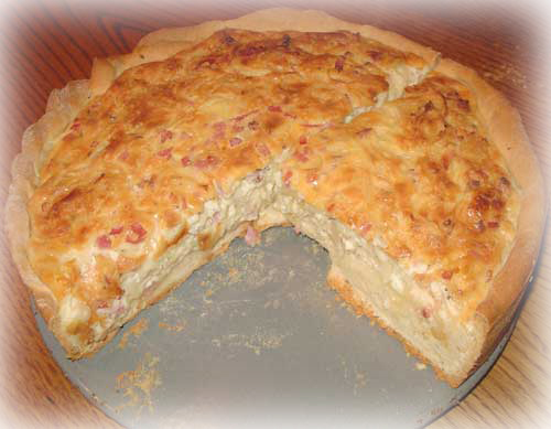 Zwiebelkuchen, German style Quiche with onions, bacon and cheese from Baden